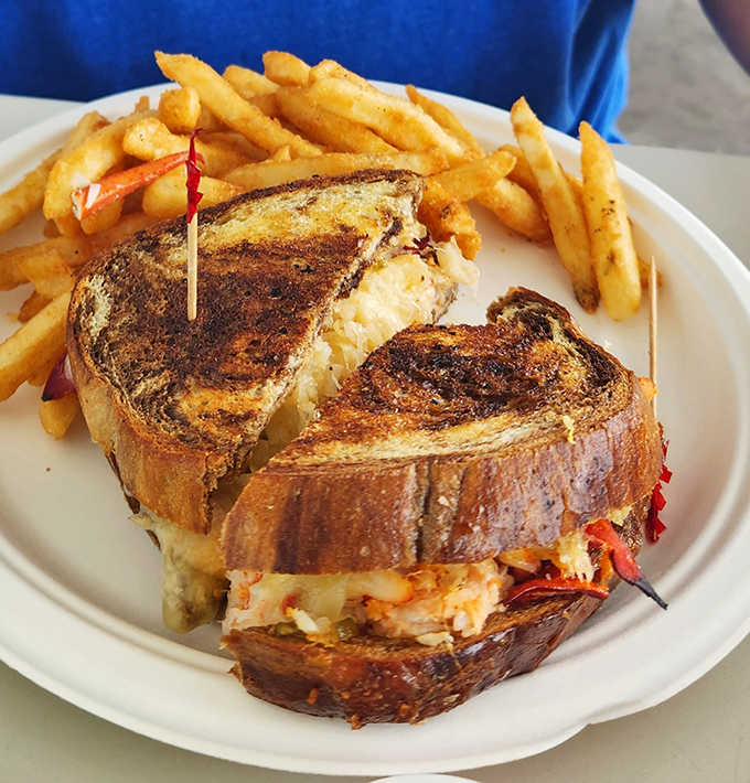 The legendary Lobster Reuben—where Maine tradition meets Florida Keys innovation. This sandwich has convinced countless seafood purists to embrace delicious heresy.