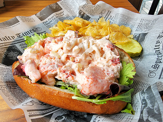 Behold the lobster roll in all its glory – chunks of sweet meat barely contained by its toasted vessel. A newspaper liner means business.