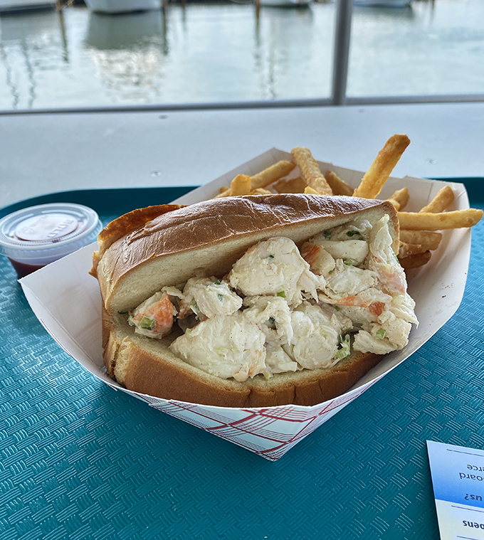 Lobster roll perfection with a waterfront view. Some treasures aren't buried—they're served in a split-top roll.