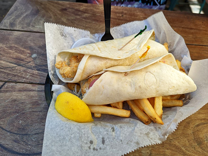 These Mahi tacos aren't just wrapped, they're gift-wrapped. The lemon wedge is just showing off at this point.
