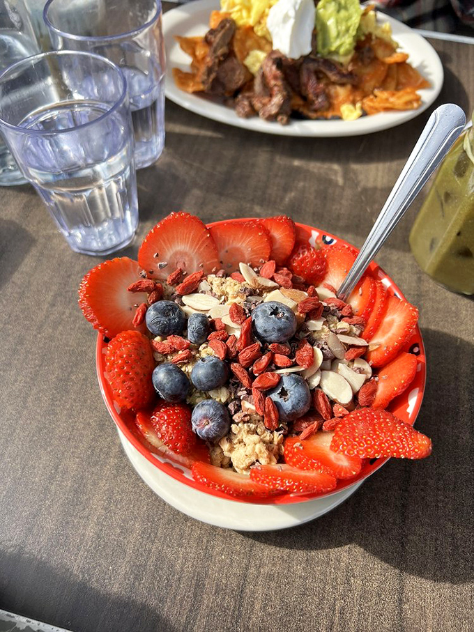 Nature's candy store in a bowl—where strawberries, blueberries, and granola create a breakfast symphony that makes your morning playlist jealous.