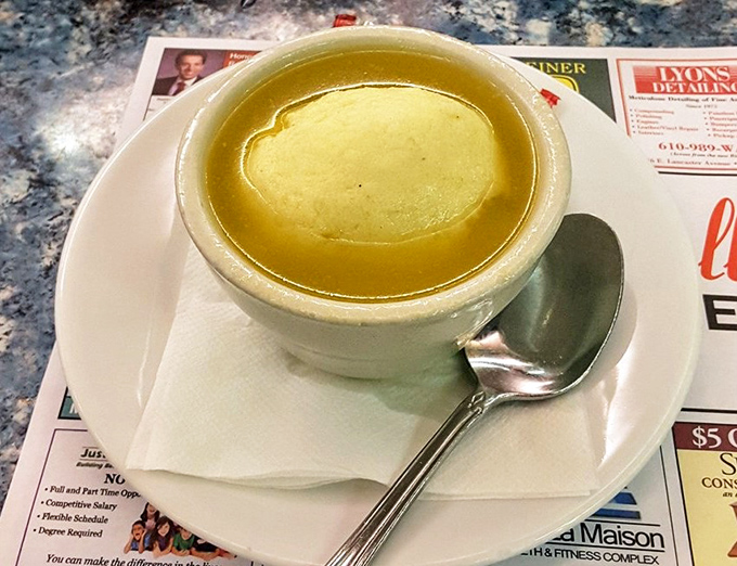 A bowl of soup that looks like liquid comfort—clear broth gleaming with promise, ready to cure whatever ails you on a Pennsylvania afternoon.
