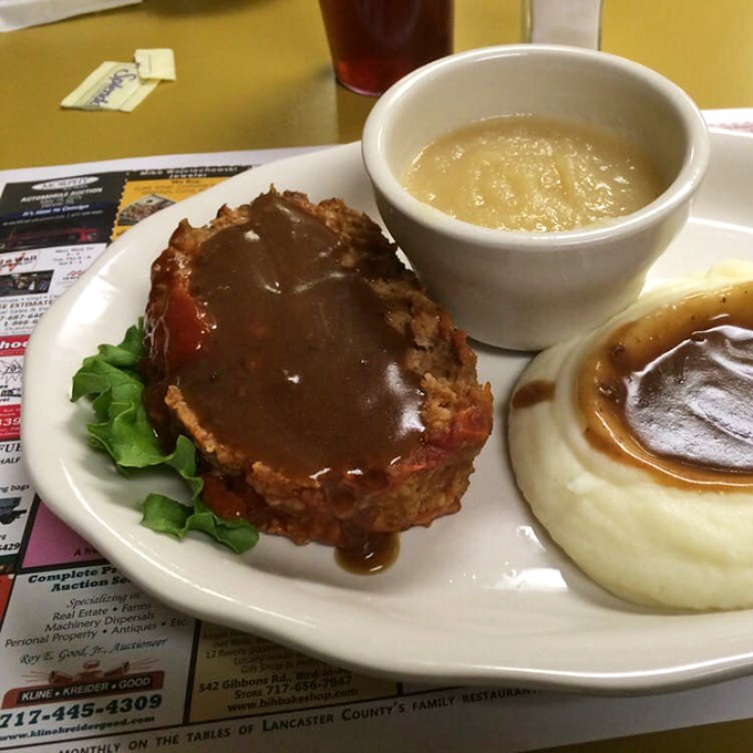 Meatloaf that would make your grandmother both proud and jealous. That gravy doesn't just cover the meat—it embraces it like a long-lost friend.