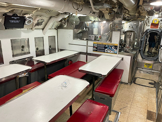 The mess hall doubled as social hub, movie theater, and meeting space. Sailors ate, played cards, and plotted world domination (or just dreamed of home).