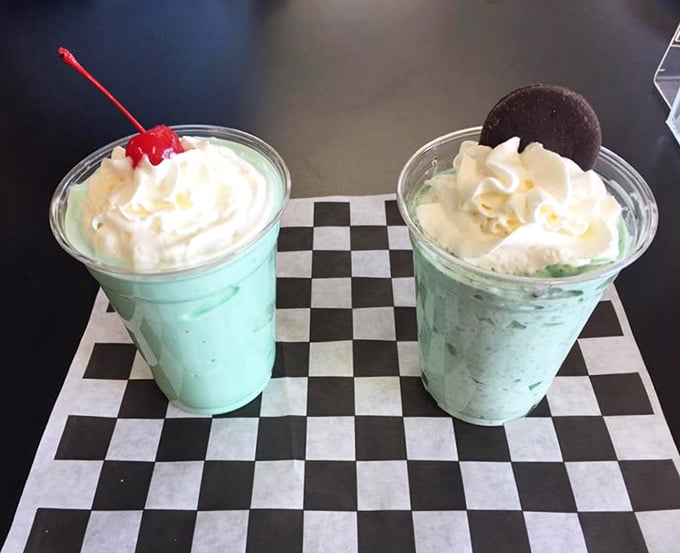 Mint green shakes topped with clouds of whipped cream—visual proof that sometimes the simplest pleasures deliver the most profound joy.