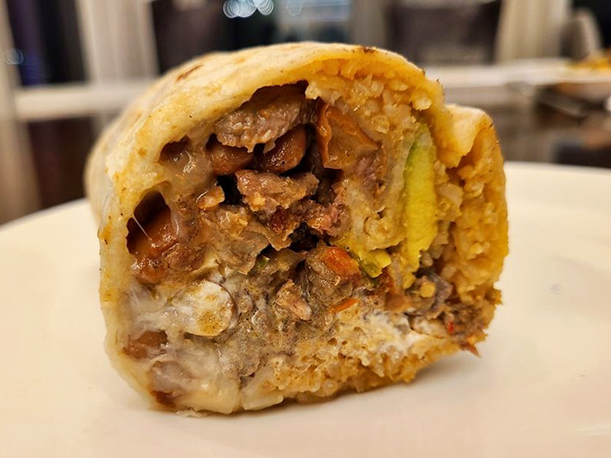 The Mission-style super burrito in its natural habitat—perfectly grilled, expertly wrapped, and ready to cure whatever ails you.