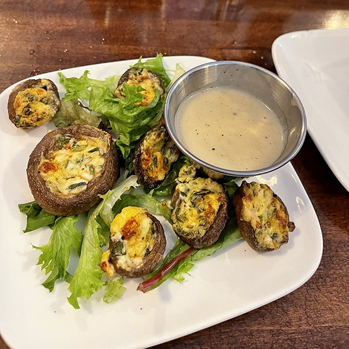 These aren't just stuffed mushrooms – they're little umami bombs of joy. The dipping sauce isn't necessary, but neither was the Sistine Chapel ceiling.