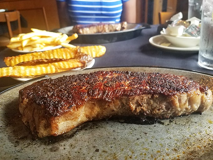 This NY Strip isn't just a steak; it's a masterclass in crust development with those beautiful grill marks telling tales of proper heat.