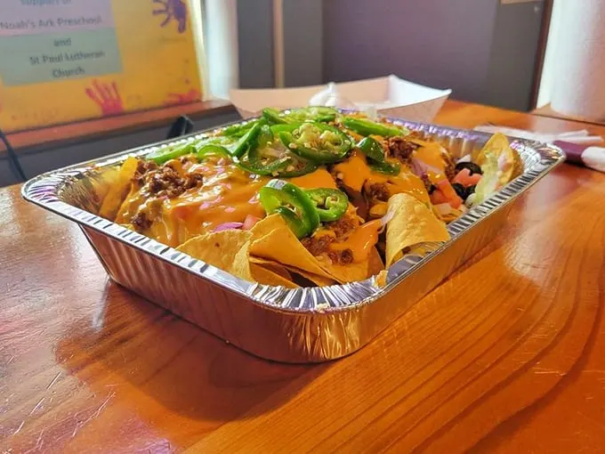 These loaded nachos aren't just a dish, they're an architectural achievement of cheese, jalapeños, and happiness stacked in perfect harmony.