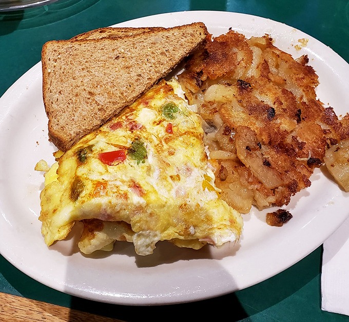 Breakfast doesn't get more Baltimore than this: a veggie-packed omelet with crispy home fries and toast—the morning fuel of champions.