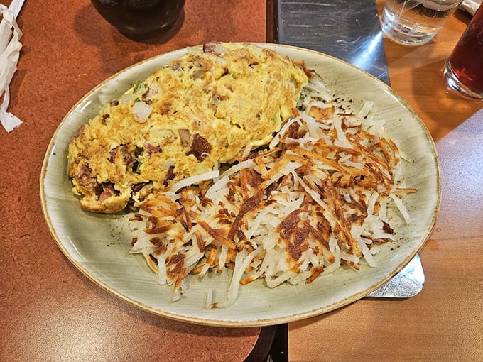 A perfect marriage of fluffy eggs and crispy hash browns—this plate doesn't need a filter to make your friends jealous.