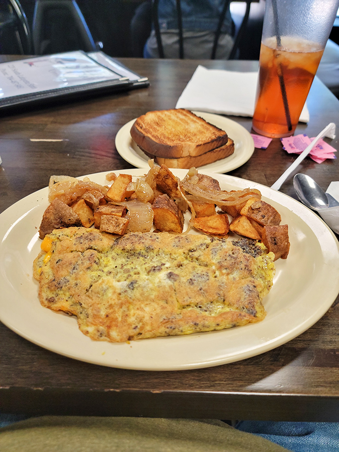 This isn't just an omelet—it's a morning masterpiece with home fries that could make a potato proud. Breakfast alchemy at its finest.