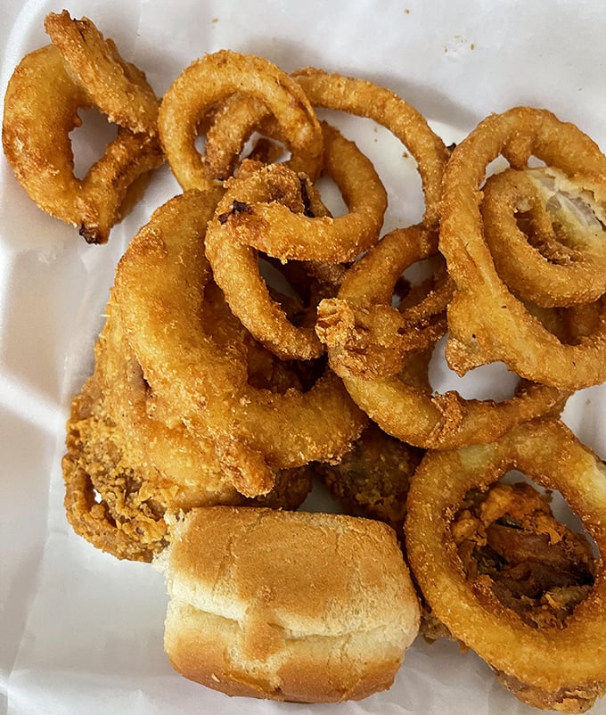 Onion rings that demand respect—crispy, substantial, and unapologetically golden. The perfect supporting actor to the chicken's starring role.