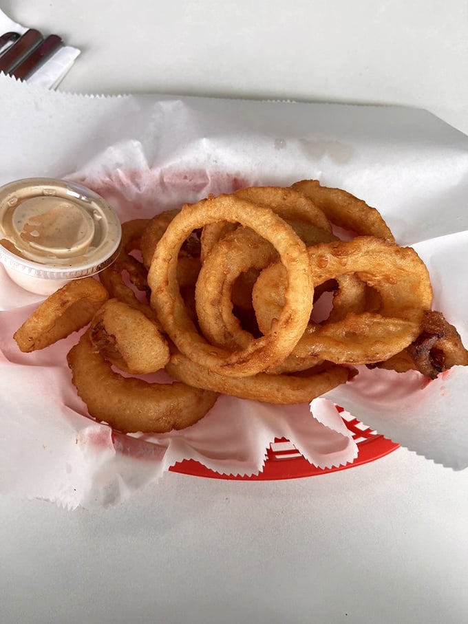 These onion rings aren't just fried—they're golden halos of crunch that make you question why salads were ever invented.