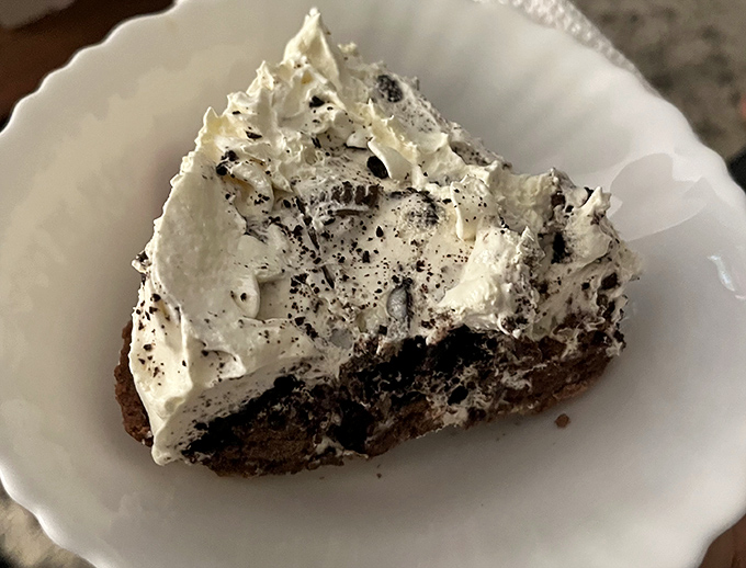 This isn't just Oreo pie – it's a cloud of creamy nostalgia topped with cookie dust that would make your childhood self high-five your adult self.
