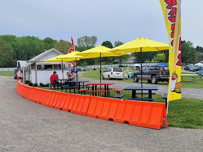 Bright yellow umbrellas mark the spot where weary treasure hunters refuel. The best negotiations happen after a good rest and snack.