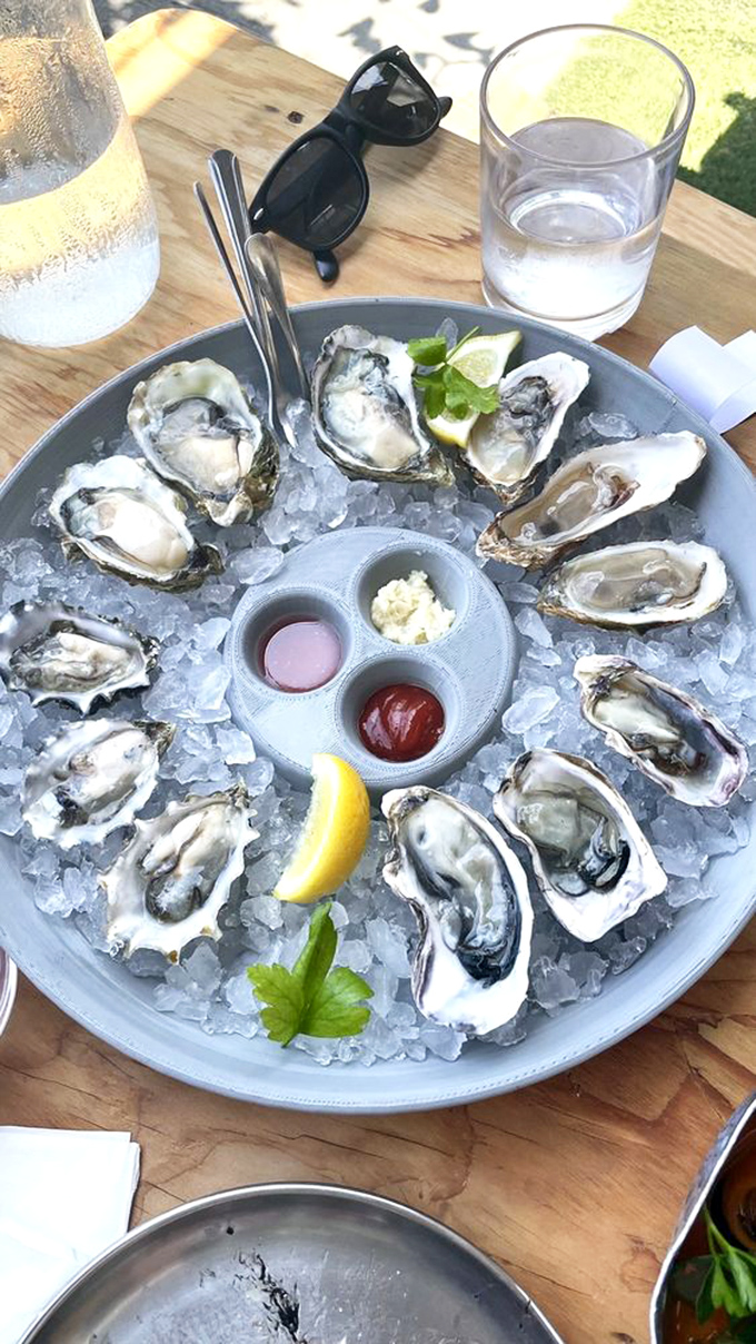 These oysters aren't just served; they're presented on a throne of ice – briny jewels waiting for their lemon crown.