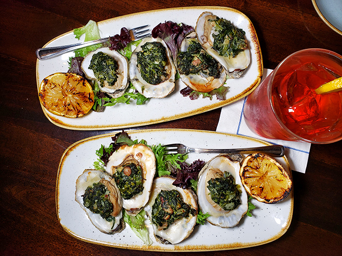 These oysters Rockefeller aren't just appetizers—they're little seafood thrones draped in spinach velvet. The ocean's perfect gift, dressed for success.