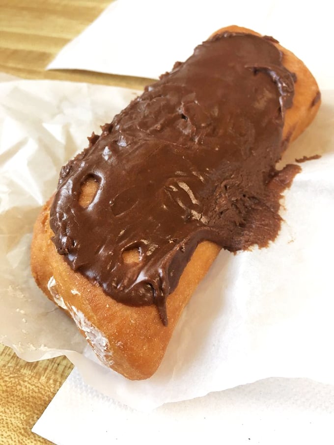 This chocolate-topped long john isn't just a donut – it's a commitment, a relationship, a love affair between chocolate and dough.