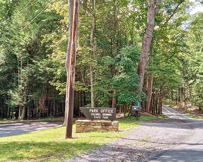 The gateway to adventure. This unassuming park office sign marks the threshold between ordinary life and woodland escape.