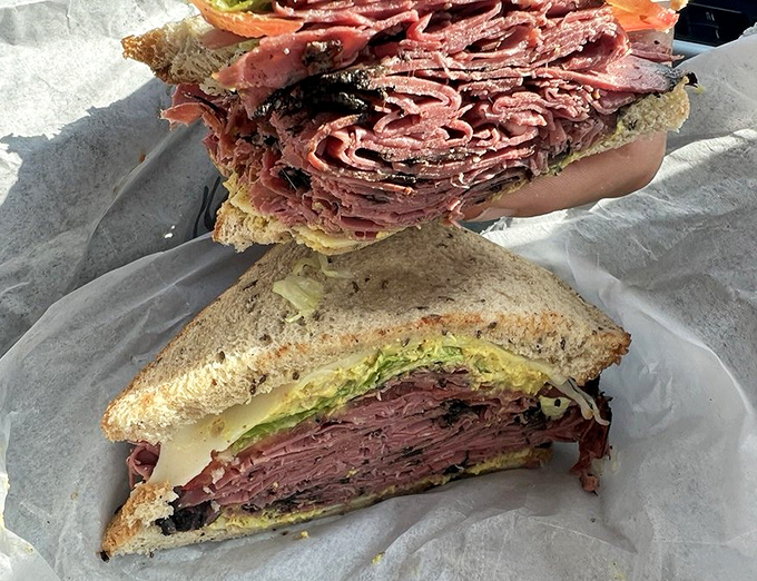 This pastrami sandwich isn't messing around. The meat-to-bread ratio here suggests someone who understands life's true priorities.