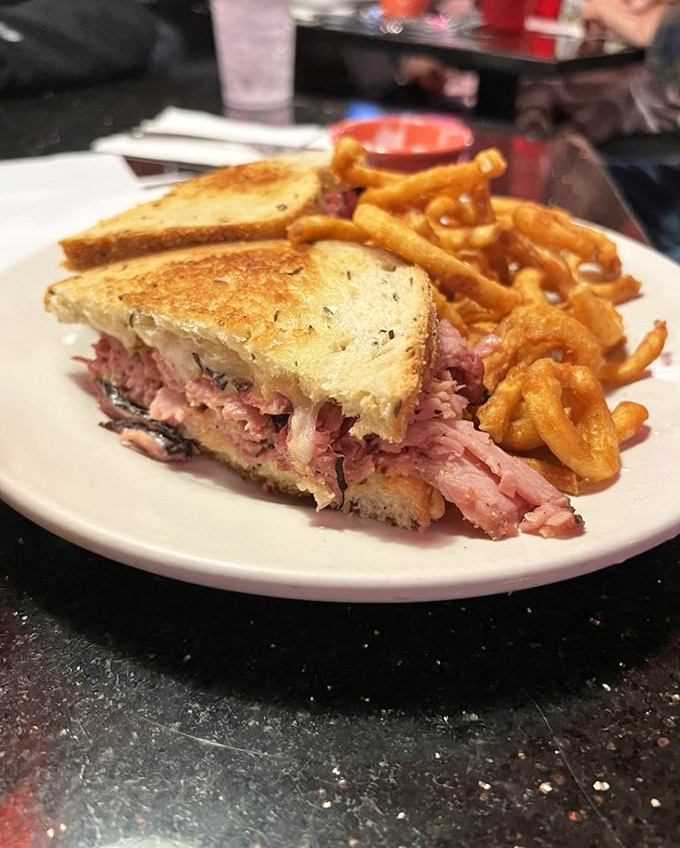 Pastrami this good doesn't need fancy presentation. Just look at those layers—this sandwich has more depth than most Hollywood blockbusters.