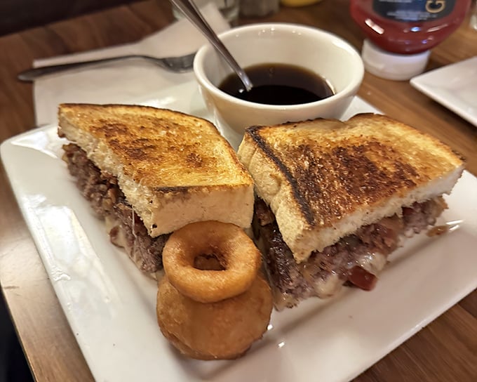 A patty melt that brings together beef, bread, and cheese in a holy trinity of tavern perfection, with onion rings playing backup.