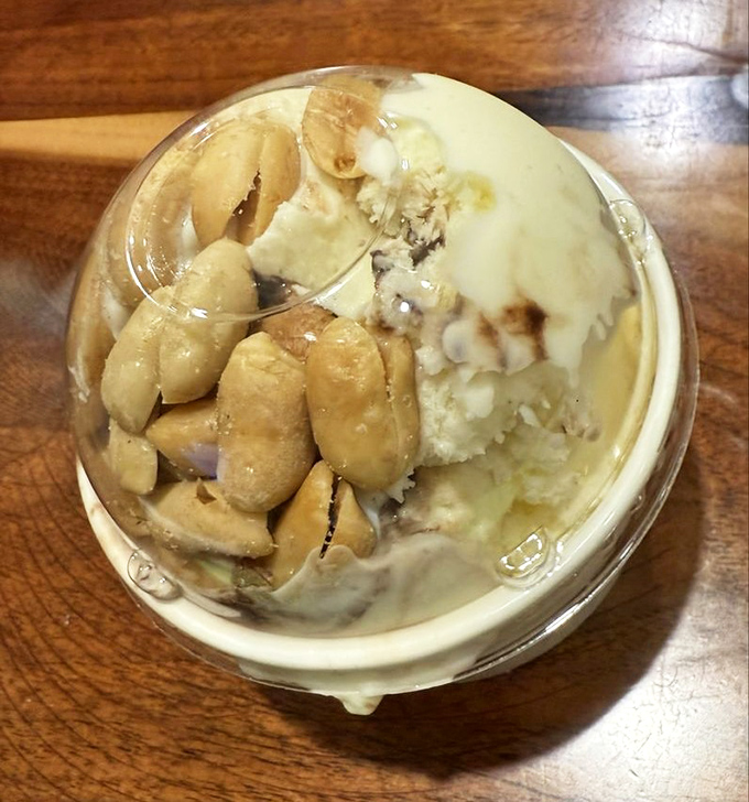 Creamy homemade ice cream studded with peanuts—proof that dessert doesn't need a passport to take you somewhere extraordinary.