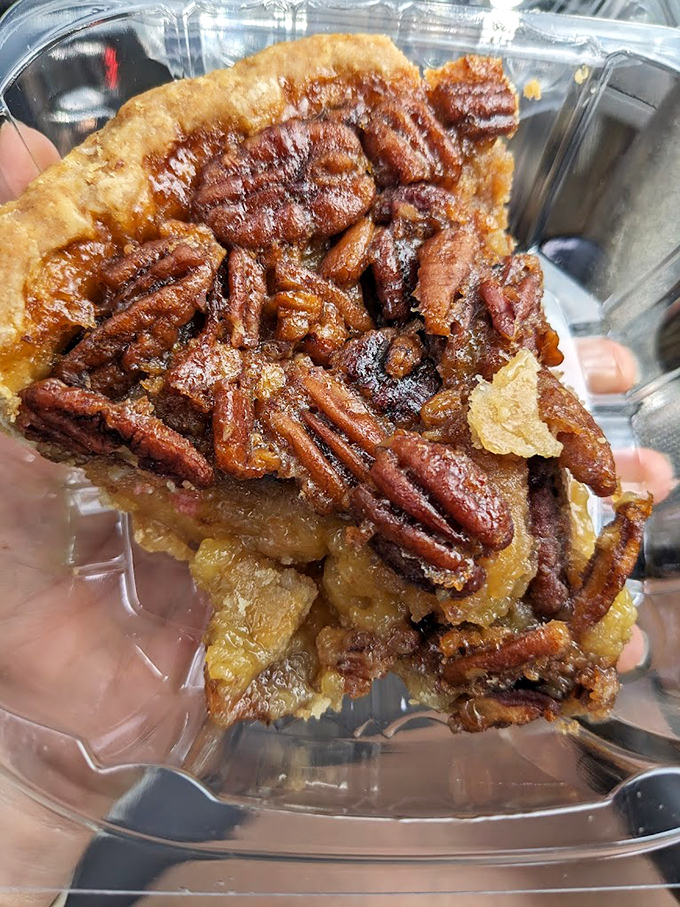 This pecan pie doesn't just have nuts on top—it's practically a pecan convention with a quorum of caramelized goodness. 