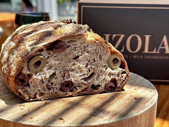 Not your average sourdough—this olive-studded masterpiece has the structural integrity of architecture and the soul of comfort food.