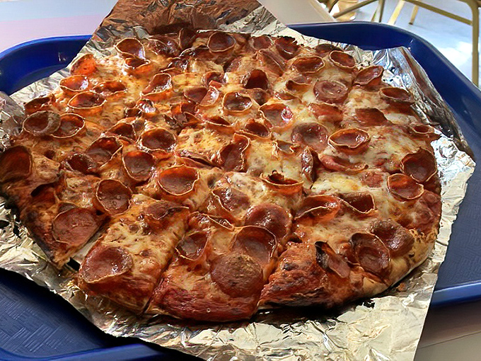 Pepperoni that curls into perfect little flavor bowls—nature's way of telling you this pizza means business.