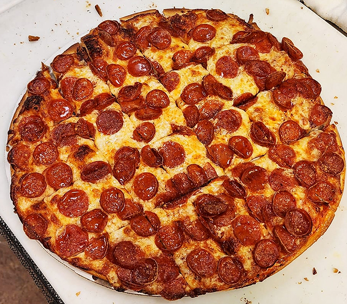 Those perfectly curled pepperoni cups collecting tiny pools of flavor are the pizza equivalent of nature's perfect design.