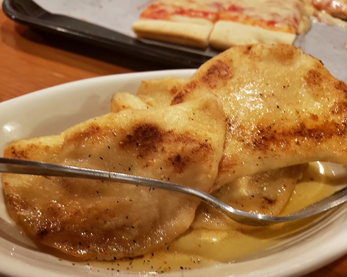 These aren't just pierogies—they're little pockets of Pennsylvania perfection swimming in butter and browned to golden bliss.