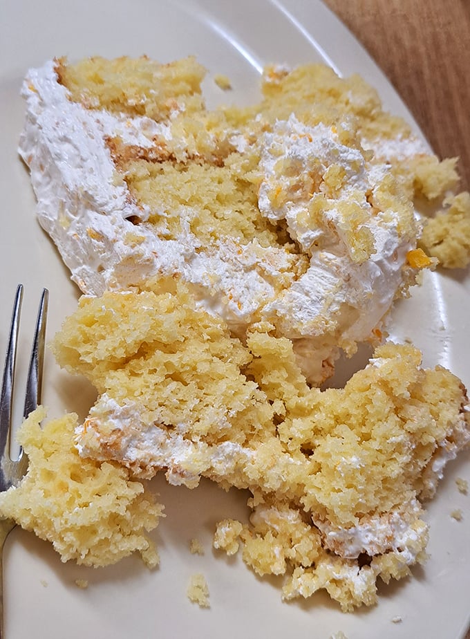 This slice of cake isn't just dessert, it's a Southern handshake. Moist yellow layers with creamy frosting that would make your grandmother beam with pride.