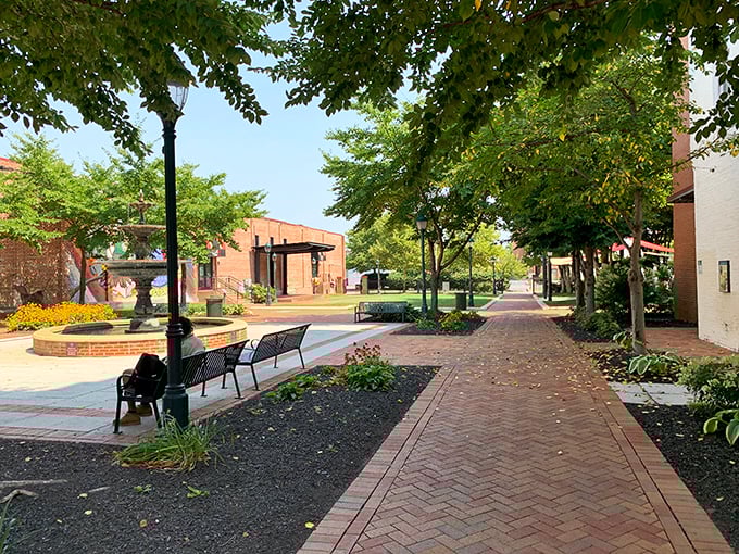 Thoughtfully designed urban spaces invite visitors to pause and enjoy the moment. These brick pathways and benches create community gathering spots throughout downtown.