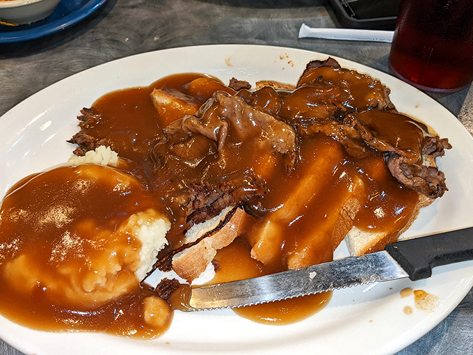 This isn't just pot roast—it's a gravy tsunami over tender beef and mashed potatoes. The kind of open-faced sandwich that demands both a fork and your undivided attention.