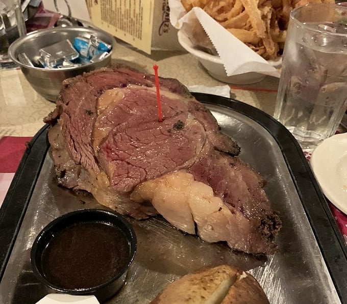 The prime rib at Schwarz's doesn't just come to your table—it makes an entrance, complete with au jus sidekick and a toothpick flag.