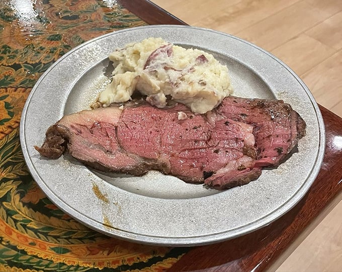 Prime rib sliced to medium-rare perfection alongside creamy mashed potatoes. This isn't just dinner—it's what carnivores dream about during meditation sessions.