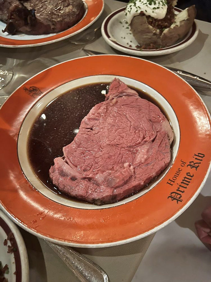 Each slice reveals a perfect pink interior that practically glistens under the dining room lights – tender enough to cut with a fork, juicy enough to make you close your eyes in appreciation.