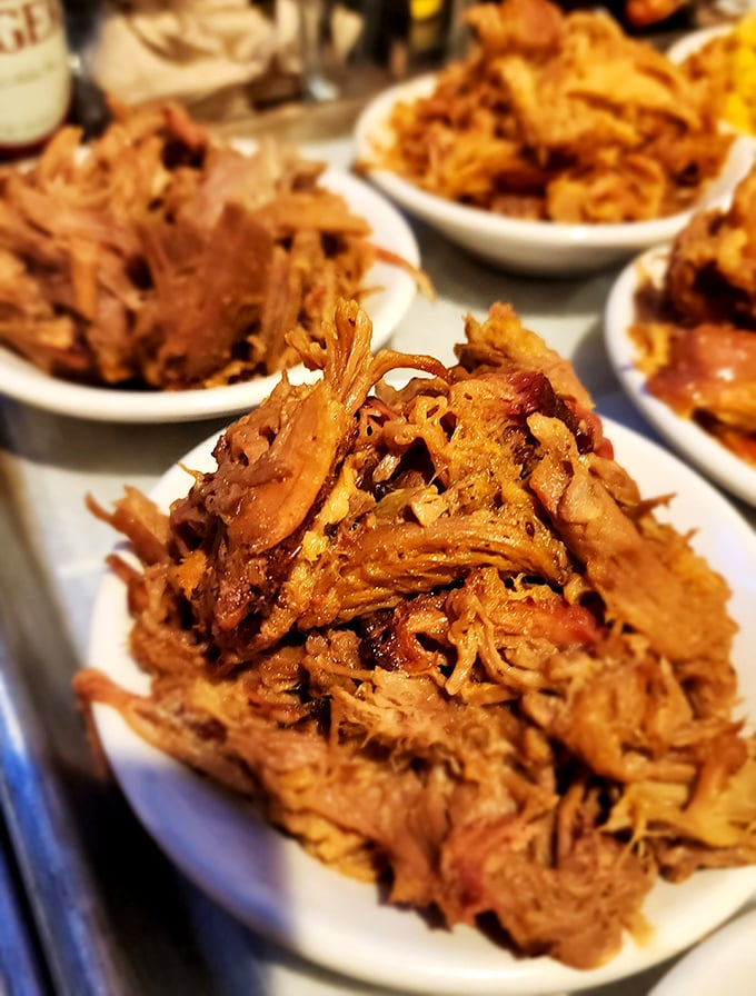 Pulled pork so tender it practically surrenders at the sight of your fork. Each strand carries the perfect balance of smoke, spice, and that unmistakable slow-cooked love.