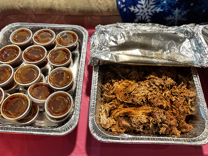 Pulled pork and sauce cups ready for their close-up. This isn't just food—it's a family-style feast waiting to happen.