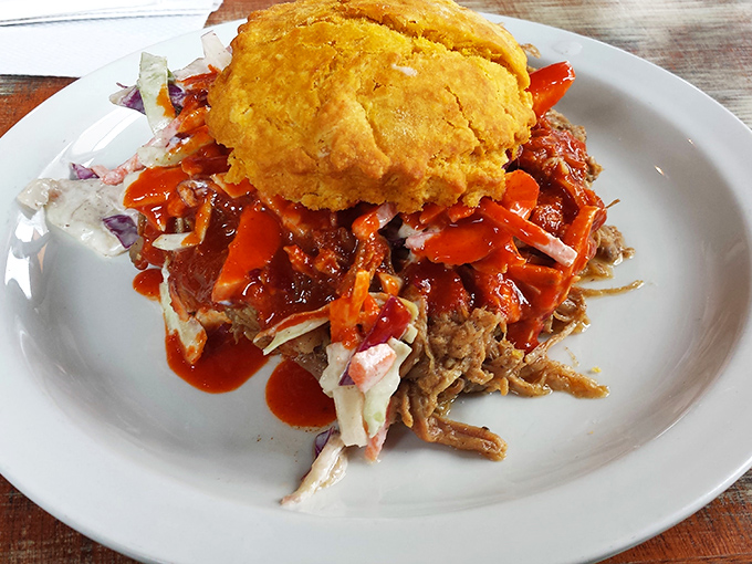 This pulled pork biscuit isn't just a sandwich—it's an architectural marvel balancing sweet, savory, and spicy in perfect Southern harmony.