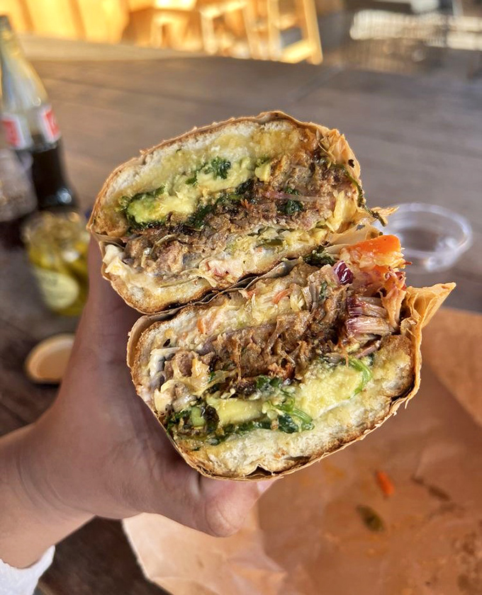 Cross-section perfection reveals the sandwich maker's soul – each ingredient purposefully placed for that moment when you take the perfect bite.