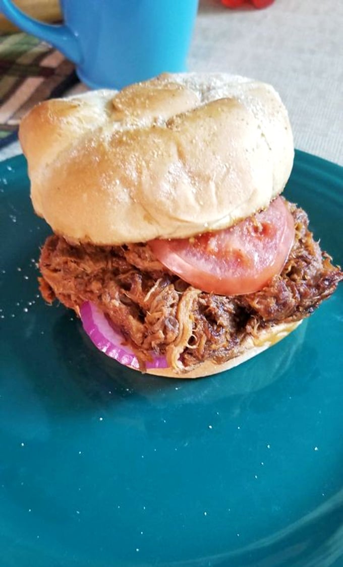The pulled pork sandwich – where smoky, tender meat meets pillowy bun in a romance worthy of a Nicholas Sparks novel.