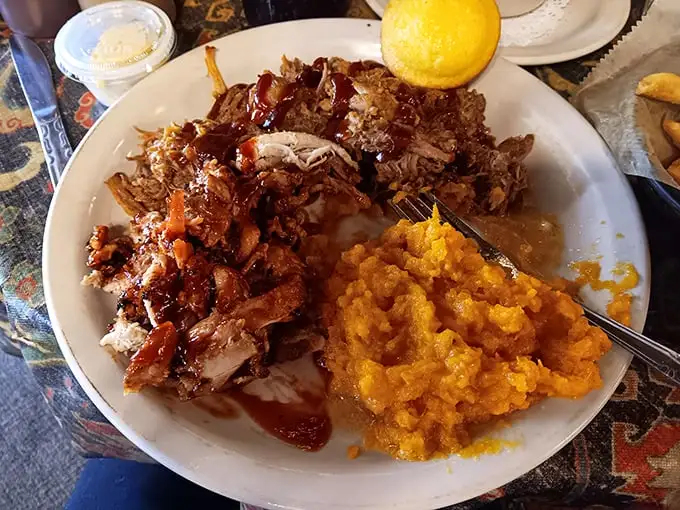 Pulled pork that doesn't need a fork—it's already surrendered to the low-and-slow treatment. Paired with sweet potato mash that's basically dessert in disguise.