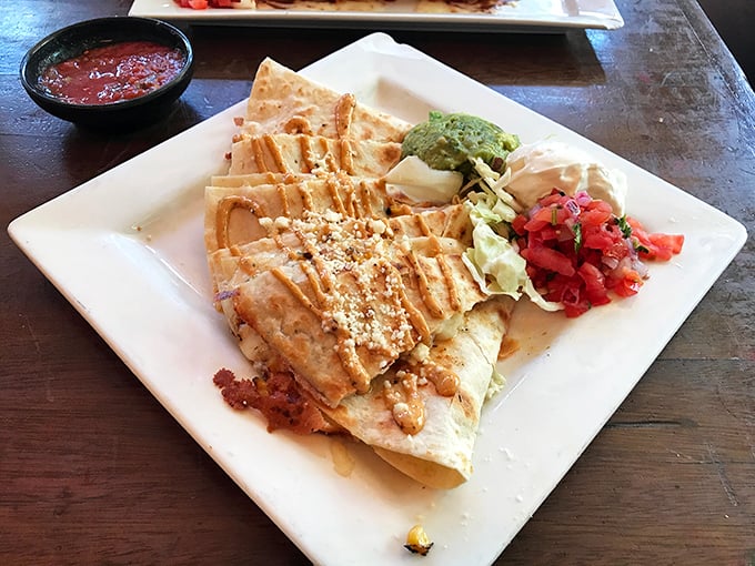 A quesadilla that doesn't just whisper cheese—it sings it, while guacamole and pico de gallo provide the perfect backup vocals.
