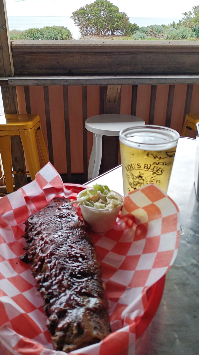 Ribs with a view—because barbecue tastes better when paired with ocean breezes and cold beer in branded glassware.