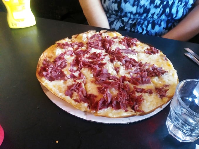 This isn't just pizza—it's a Reuben in disguise, wearing a cheesy disguise and flaunting its corned beef credentials with shameless abandon.