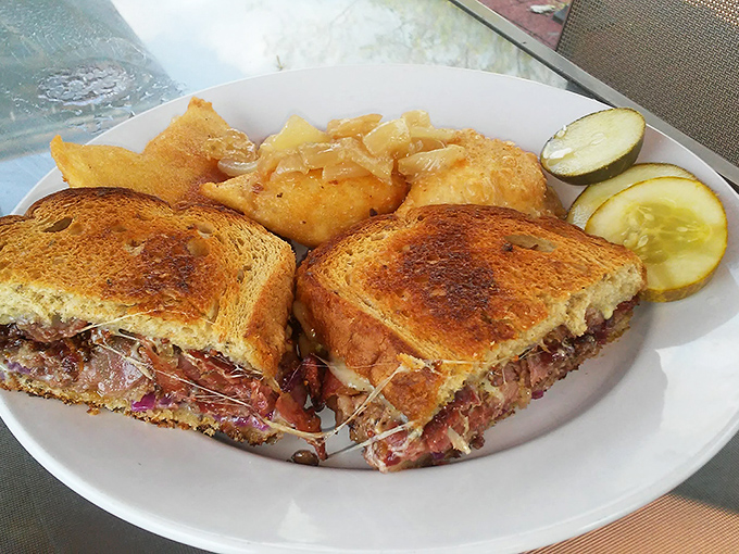 A Reuben sandwich that doesn't just speak to you—it serenades. Perfectly grilled bread embracing that magical dance of corned beef, sauerkraut, and Swiss.