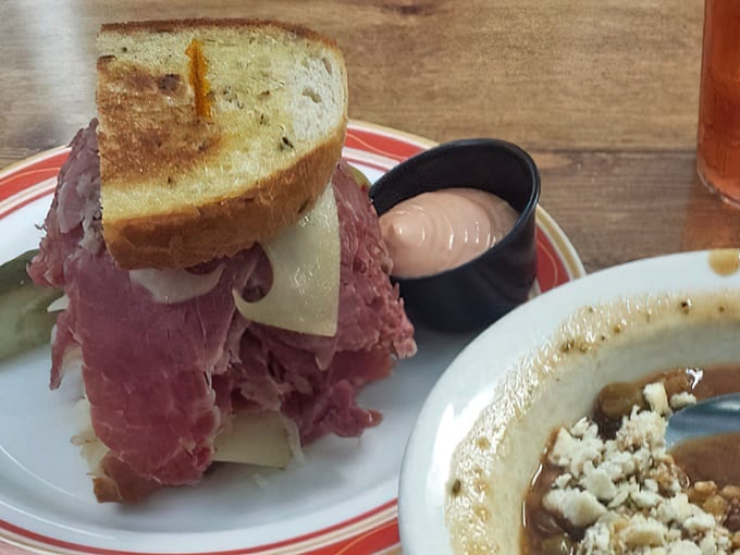 The Reuben arrives like a savory skyscraper of deliciousness—corned beef, Swiss, and sauerkraut creating that perfect harmony that makes Cleveland's deli scene legendary.